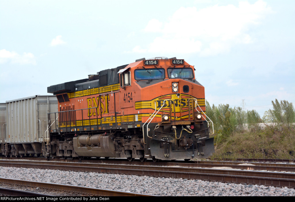 BNSF 4154 DPU on an empty gravel train